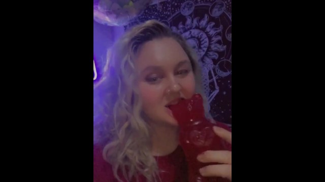 Seductive Teen Takes A Bite Out Of A Giant Gummy Bear