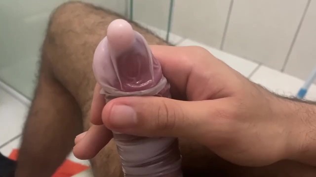 Jerking Off Playing Inside The Condom Full Of Cream Conditioner