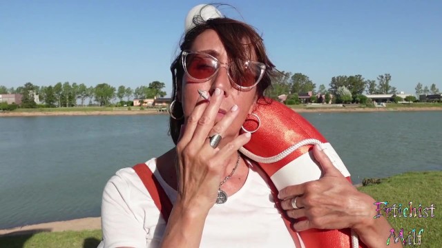 Grandma Asks A Young Man To Record Her Smoking In A Park And Plays With A Life Saving Float Alone 